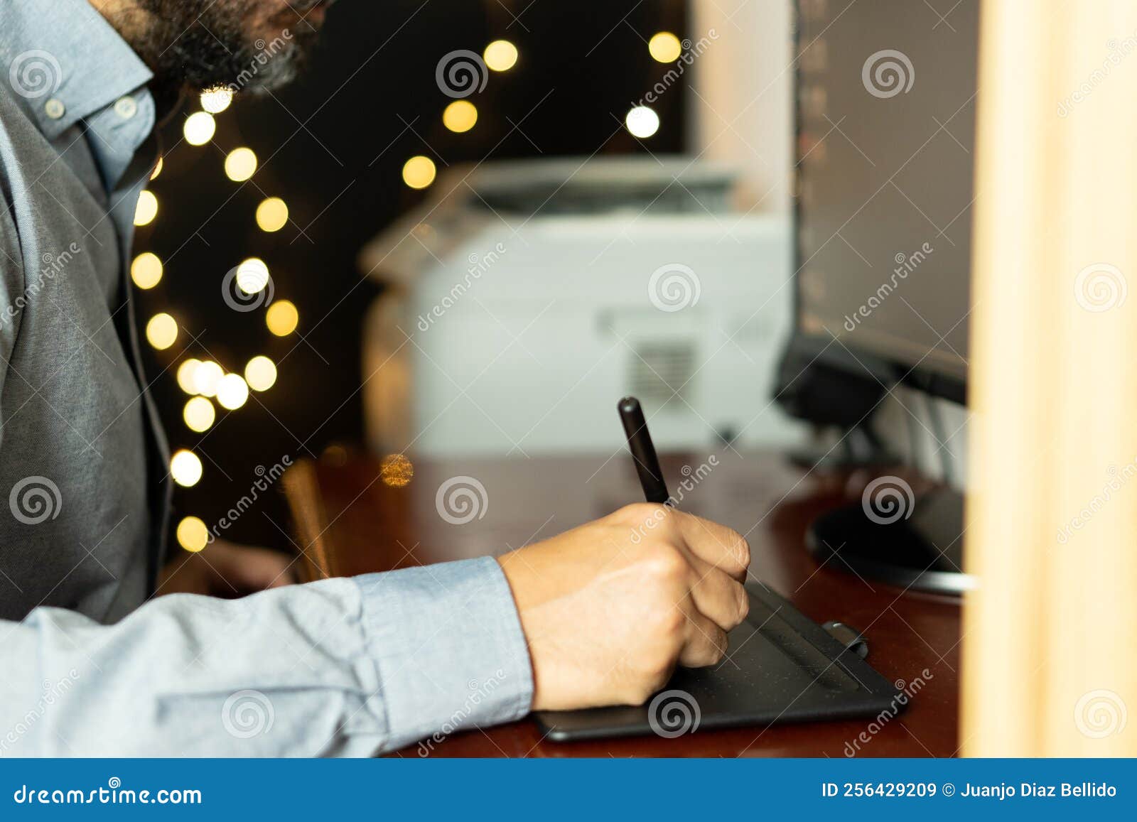 Young Graphic Designer Sitting at His Workspace Using Digital Graphics ...