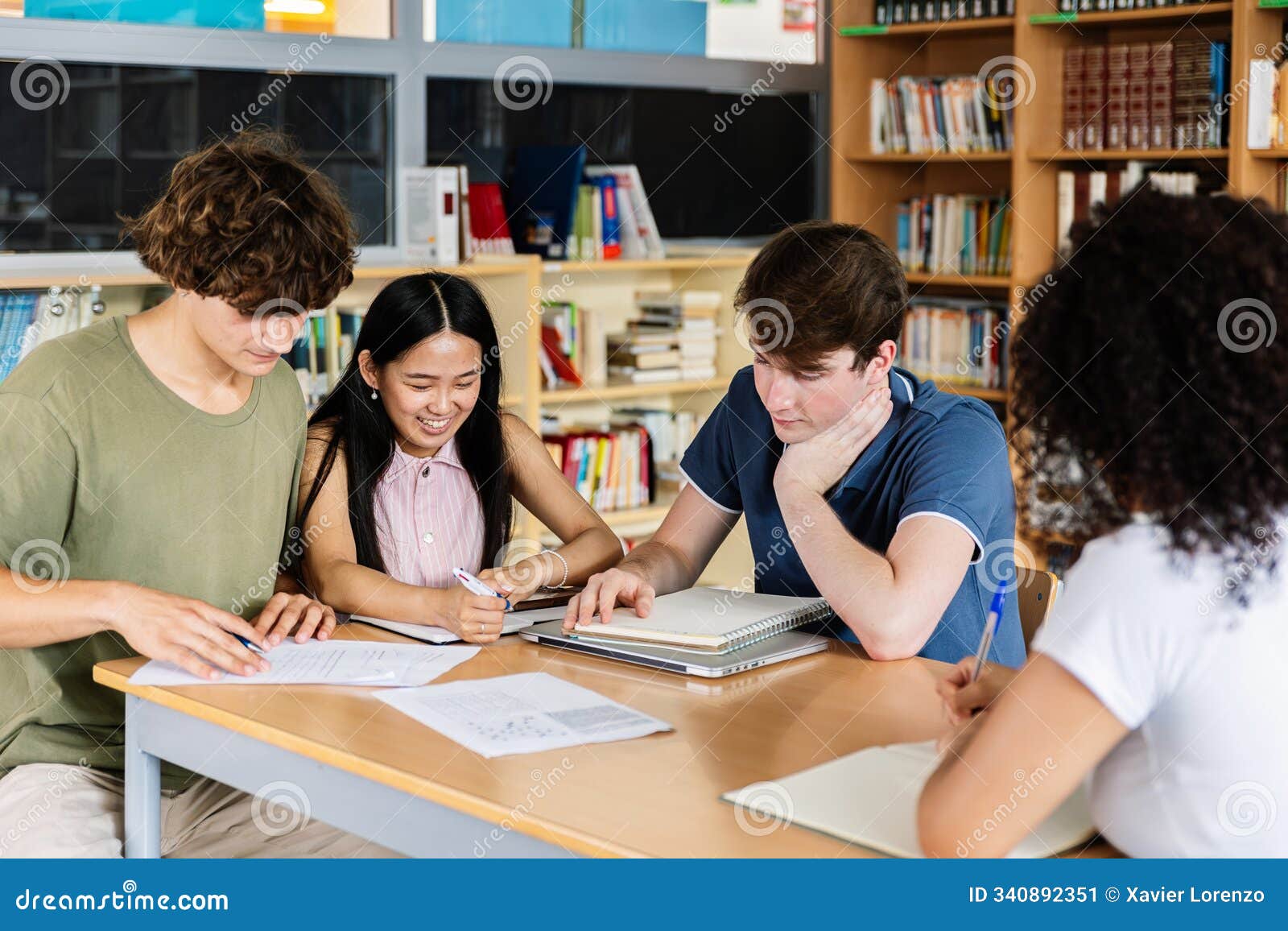 Young Group of Multiracial High School Students Learning Together at ...