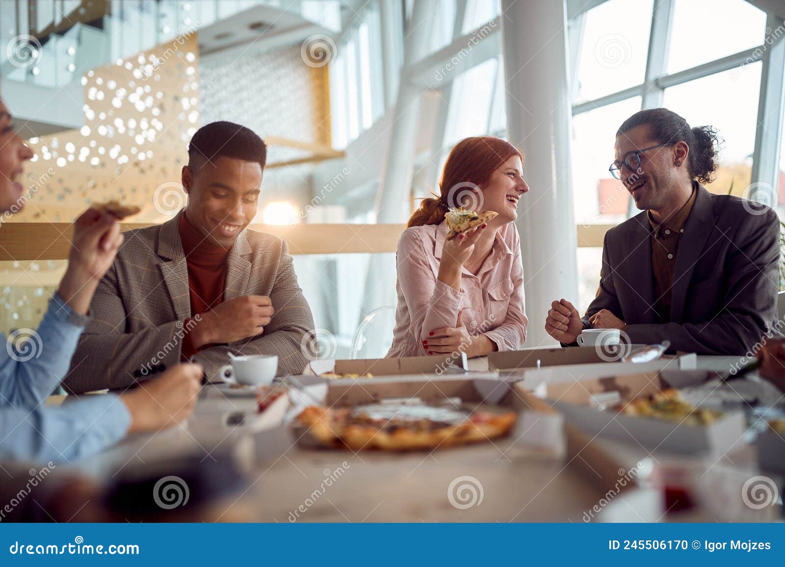 Young Group of People in Restaurant Lunch and Talks Stock Photo - Image ...
