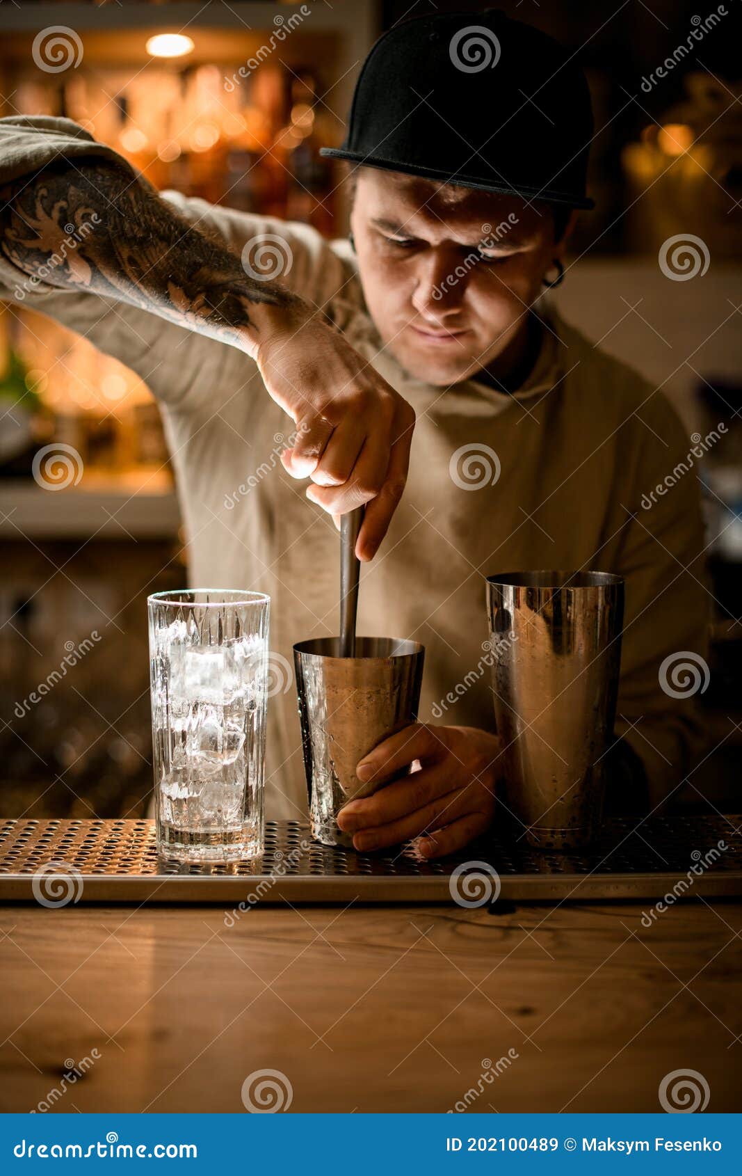 Young Guy Bartender Prepares Cocktail Using the Muddler Stock Image ...