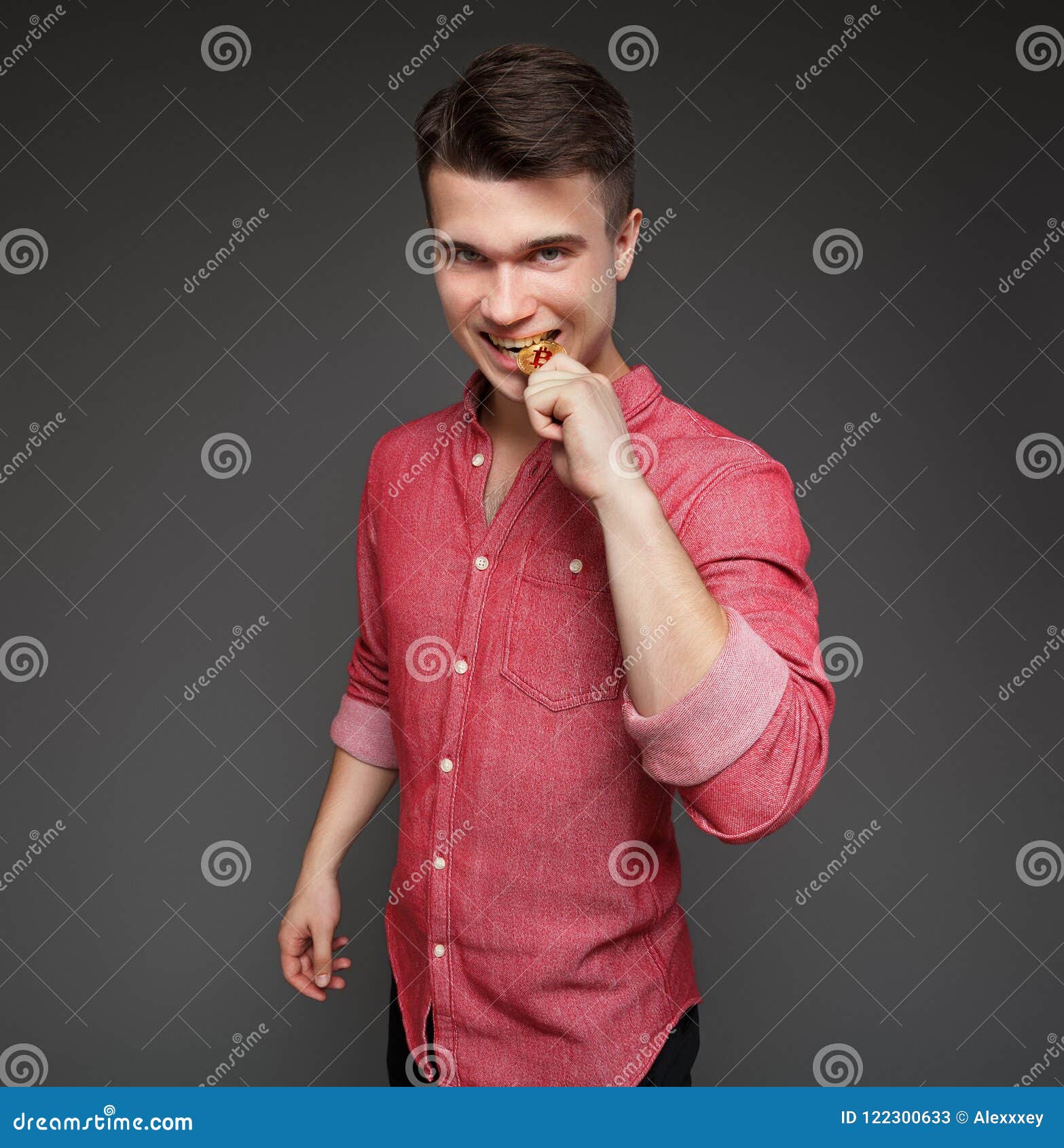 A Young Guy Bites a Coin Bitcoin with His Teeth, Checking for Au Stock ...