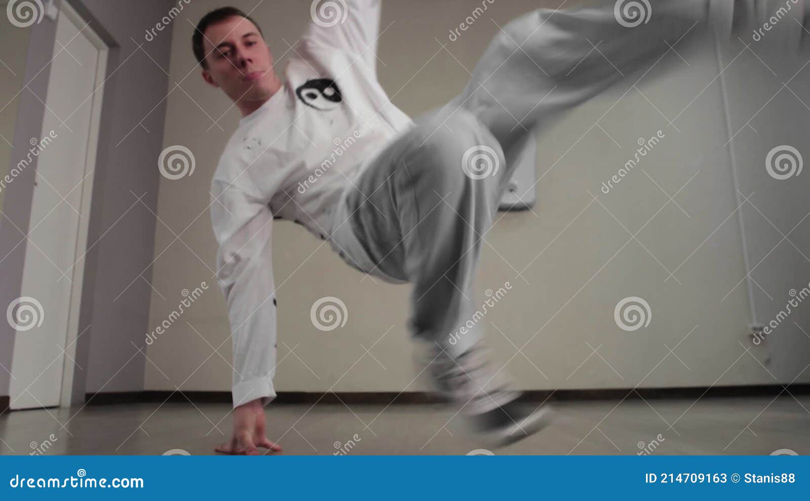 Young Guy Breakdancer Dances Hip Hop on Floor in Studio. Handsome Guy ...