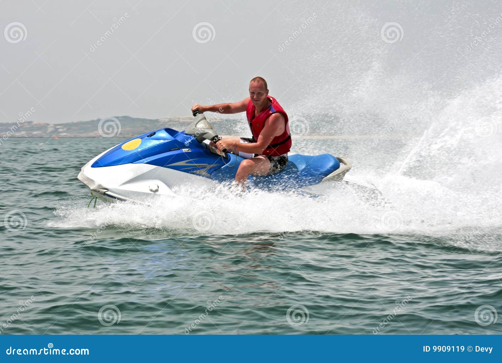 Young Guy Cruising on a Jet Ski Stock Image - Image of surf, ride: 9909119