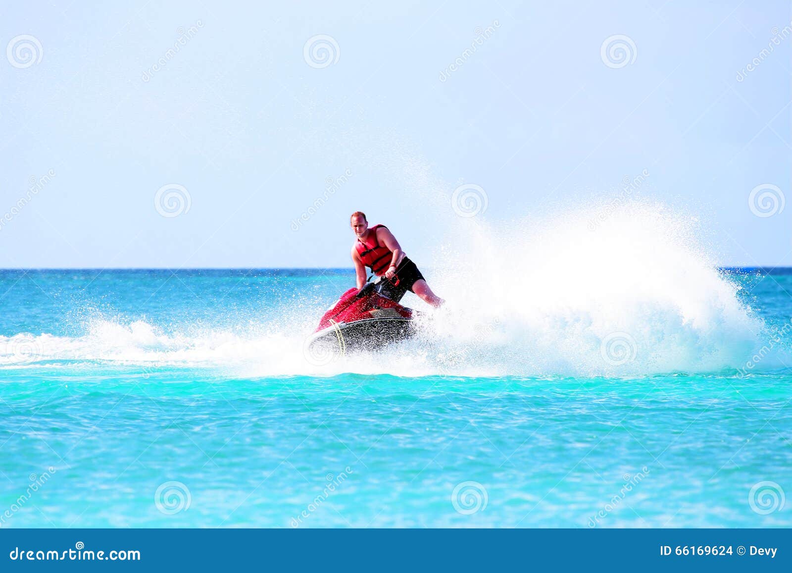 Young Guy Cruising on a Jet Ski Stock Photo - Image of seashore, blue ...