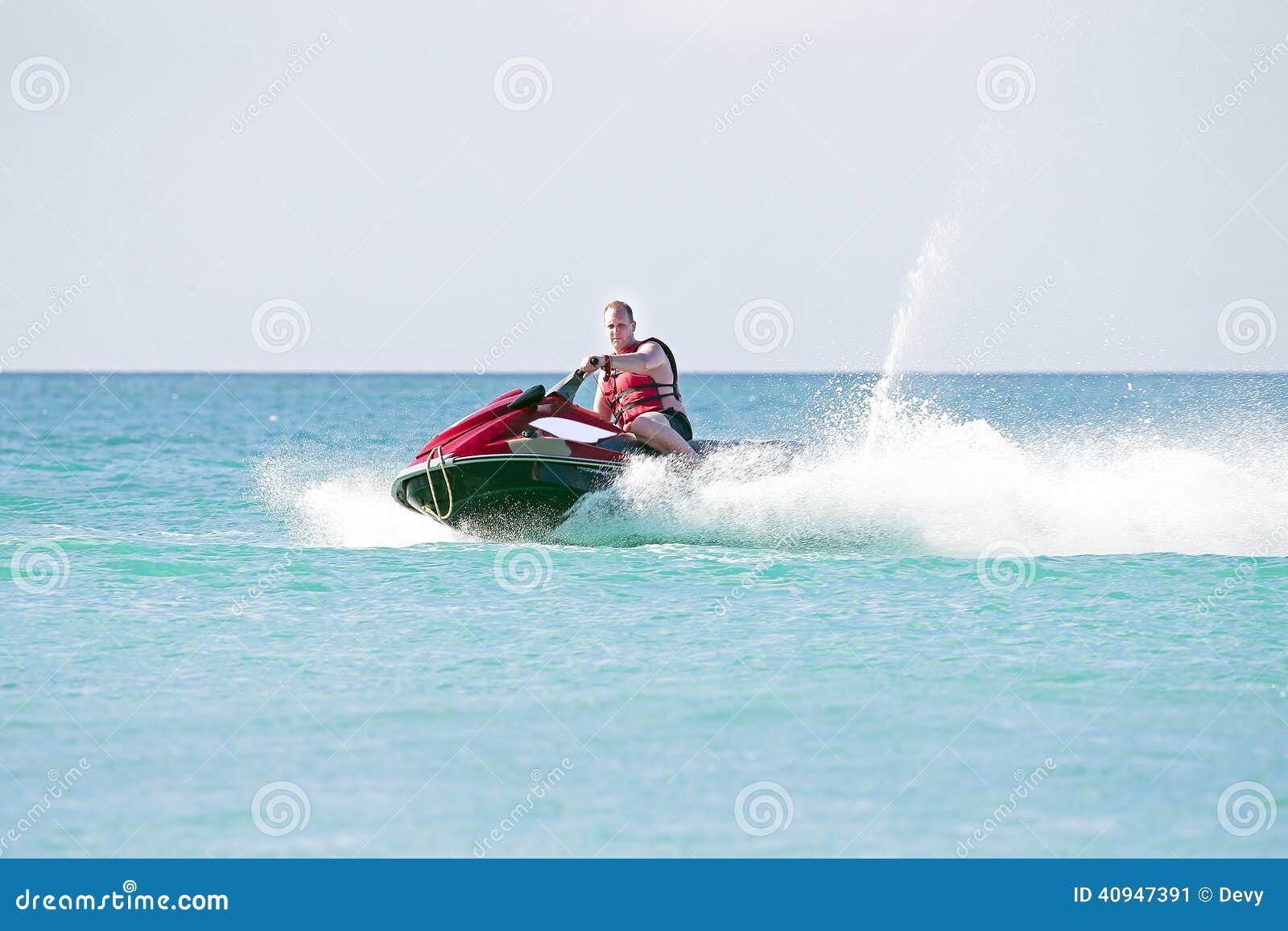 Young Guy Cruising on a Jet Ski Stock Image - Image of beach, speed ...