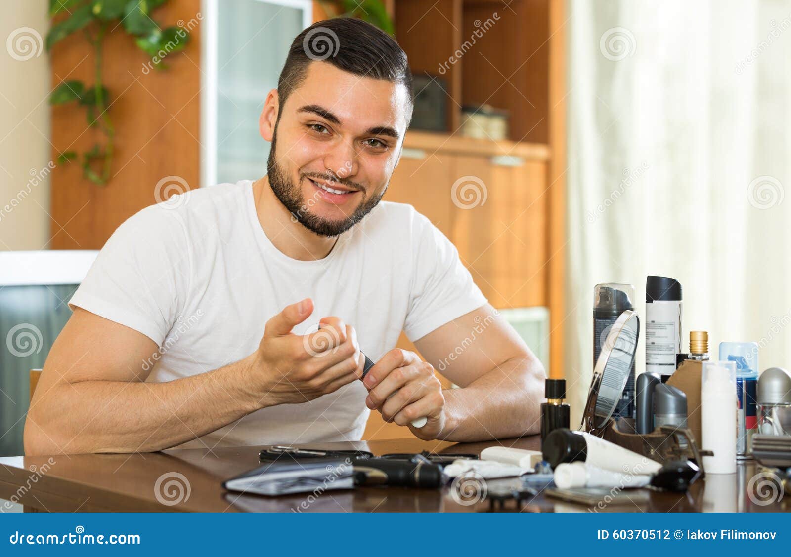 Young guy cutting nails stock photo. Image of fingernail - 60370512