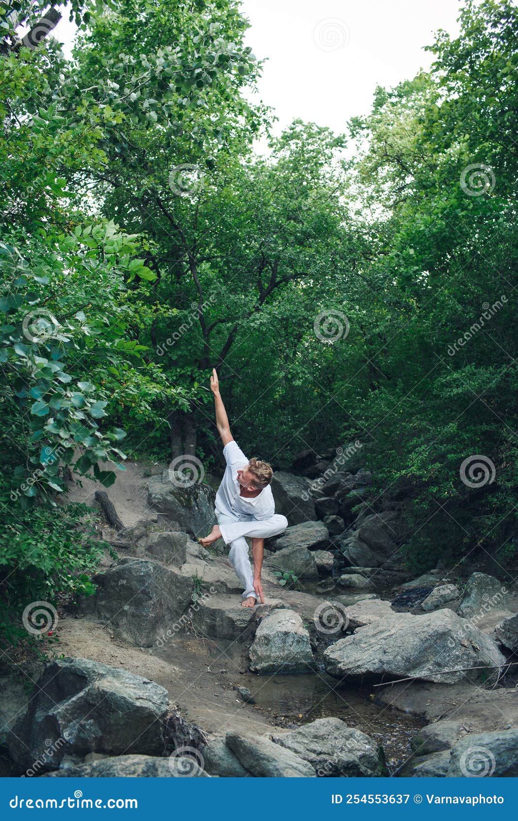 A Young Guy Does an Asana Standing on One Leg. a Man is Doing Yoga by ...