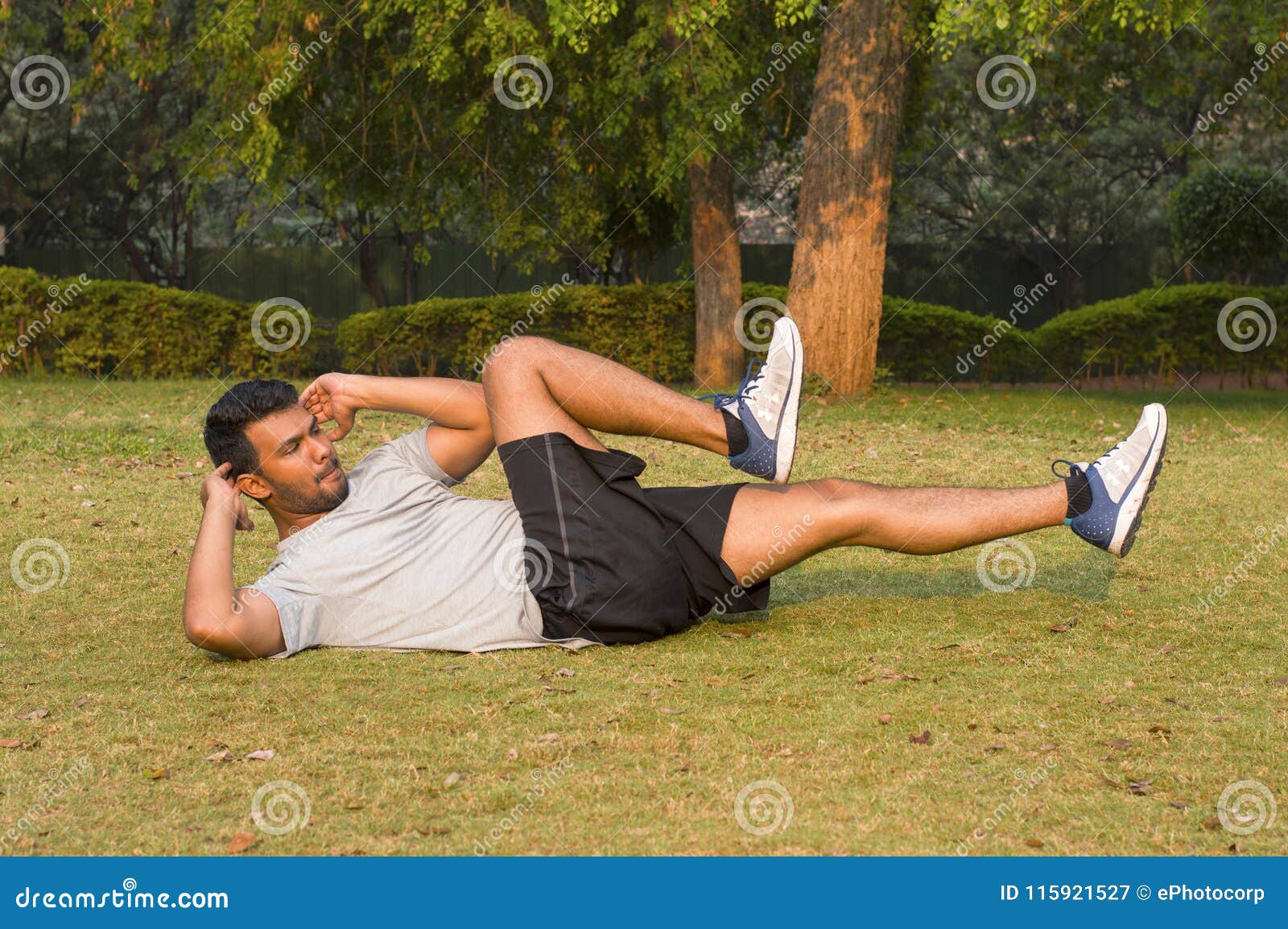 Young Guy Doing Abs Exercise Stock Image - Image of equipment, adult ...