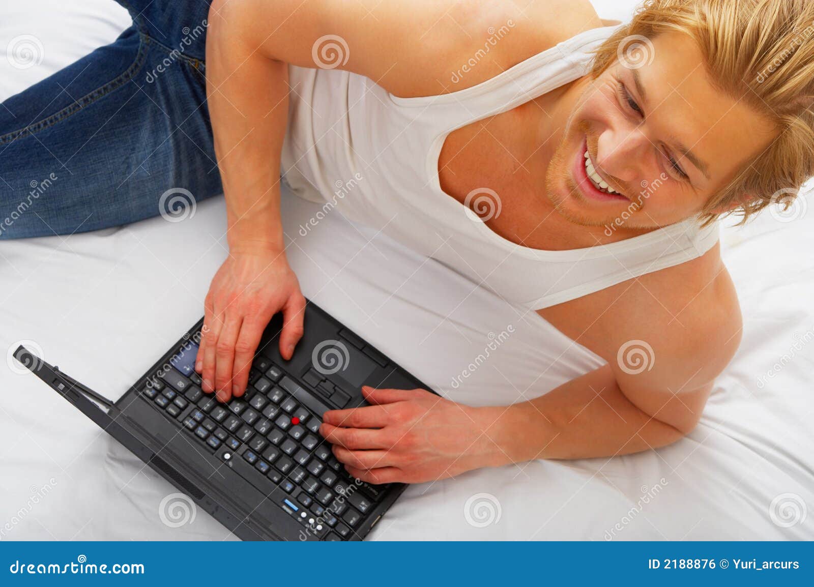 Young Guy Doing Work in Bed. Stock Photo - Image of college, female ...