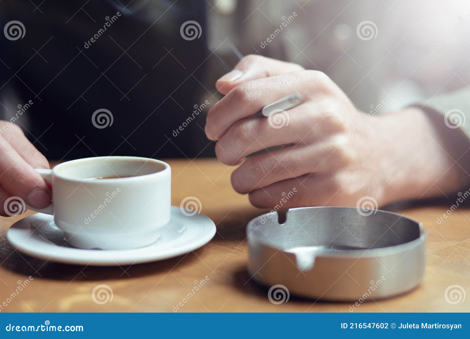 Drinks Coffee and Smokes a Cigarette in a Cafe Stock Photo - Image of ...