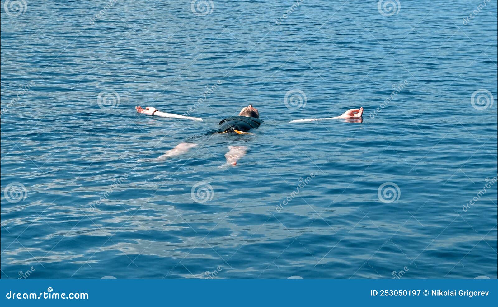 The Young Guy Drowned in the Sea. the Body Floats on the Surface ...