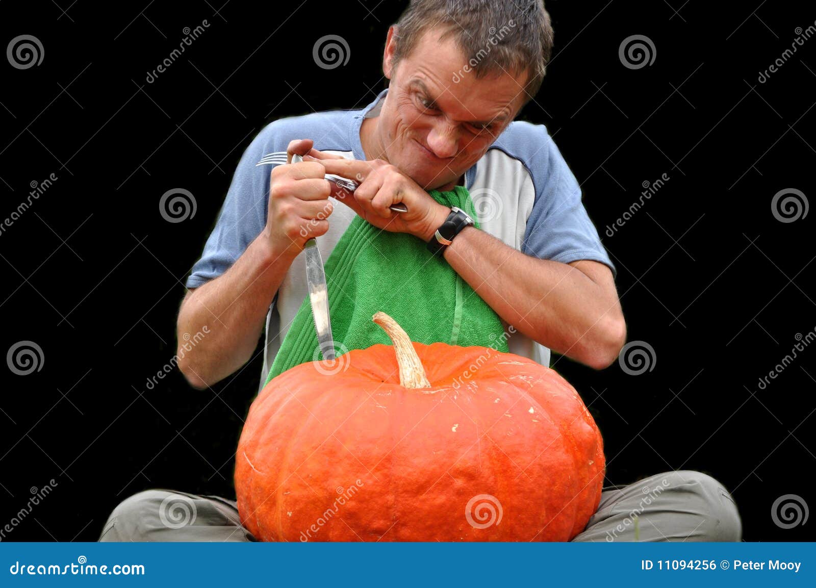 Young guy eating a pumpkin stock photo. Image of napkin - 11094256