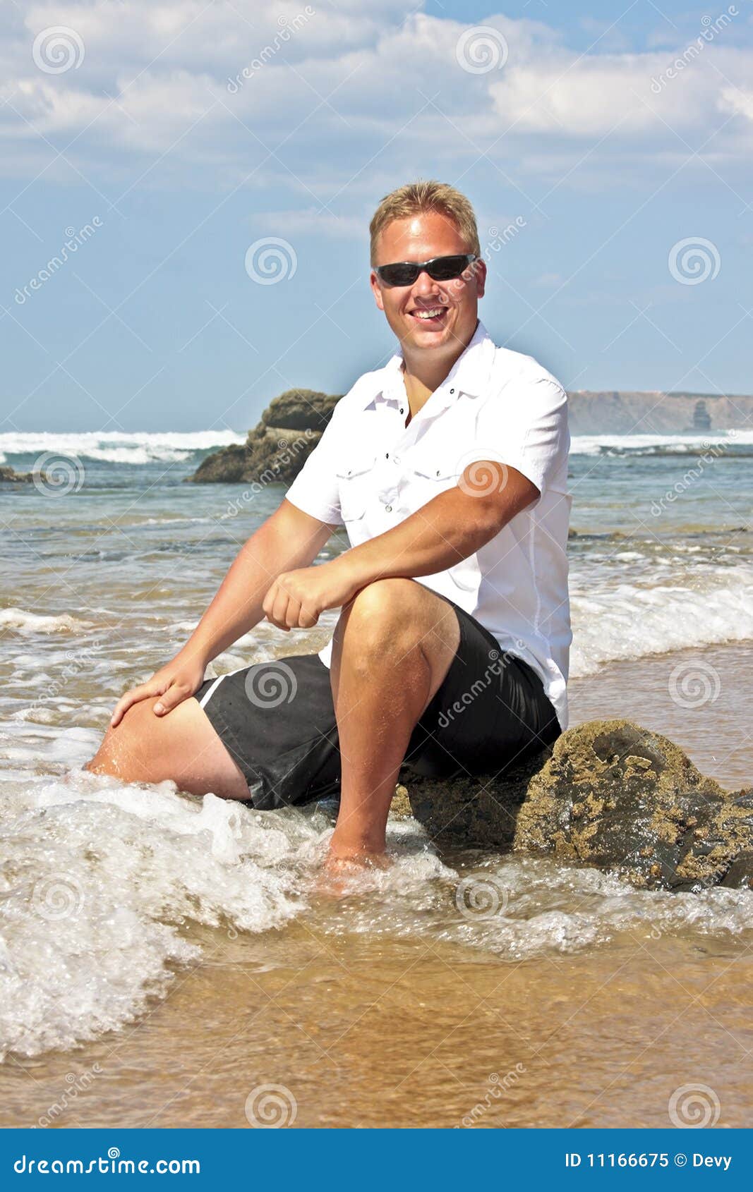 Young Guy Enjoying Holiday Sitting on a Rock Stock Image - Image of ...