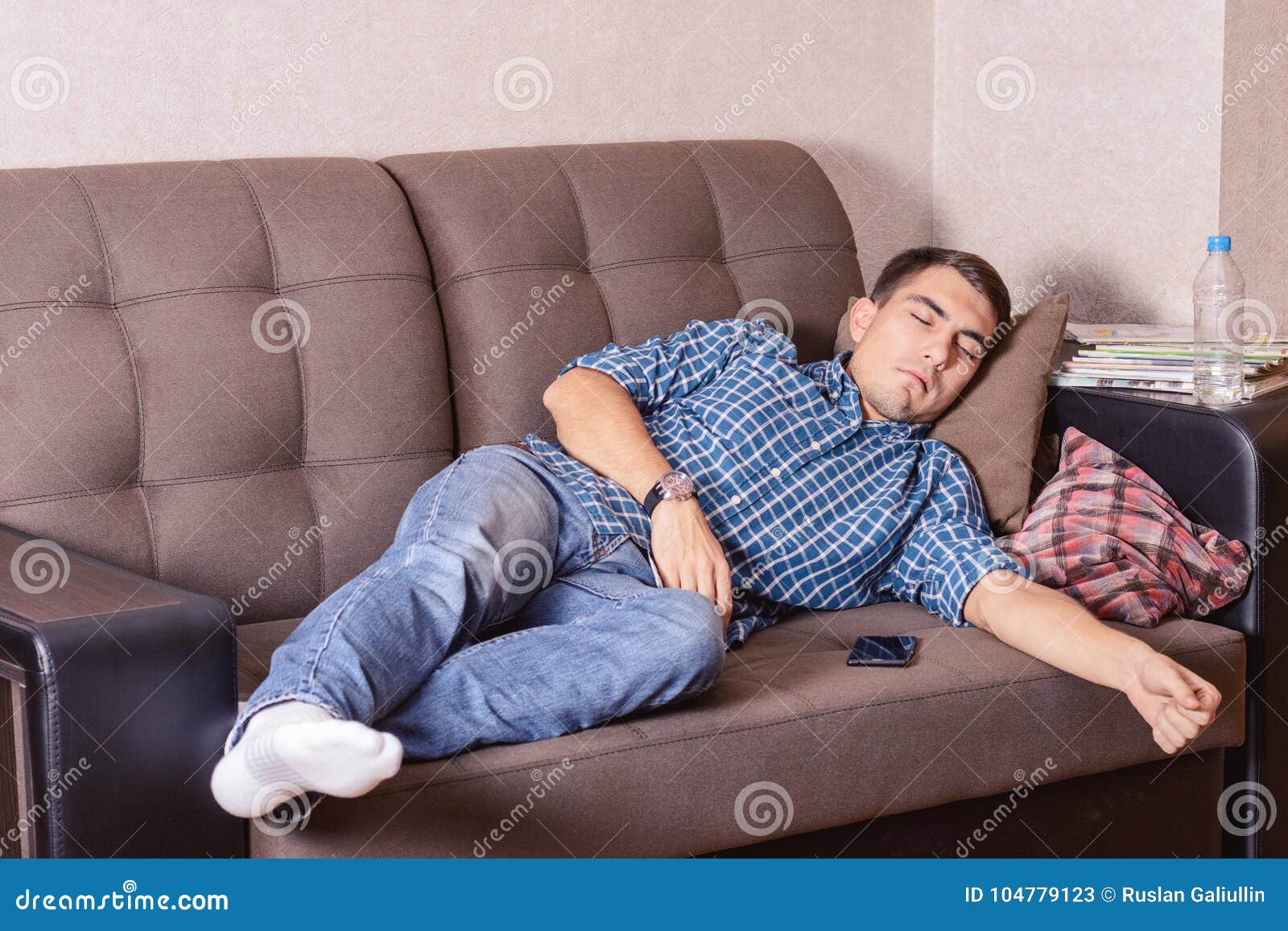 A Young Guy Fell Asleep on the Couch while Watching TV. Stock Image ... A Young Guy Fell Asleep on the Couch while Watching TV. Stock Image ...