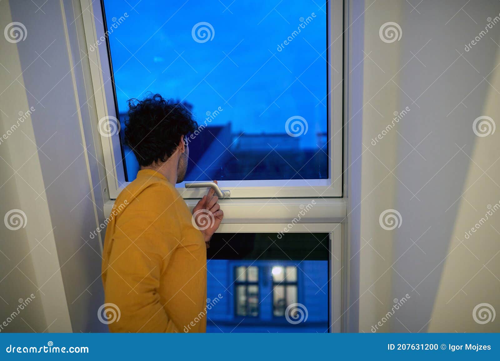 A Young Guy Looking through the Window in the Home. Morning, Home ...
