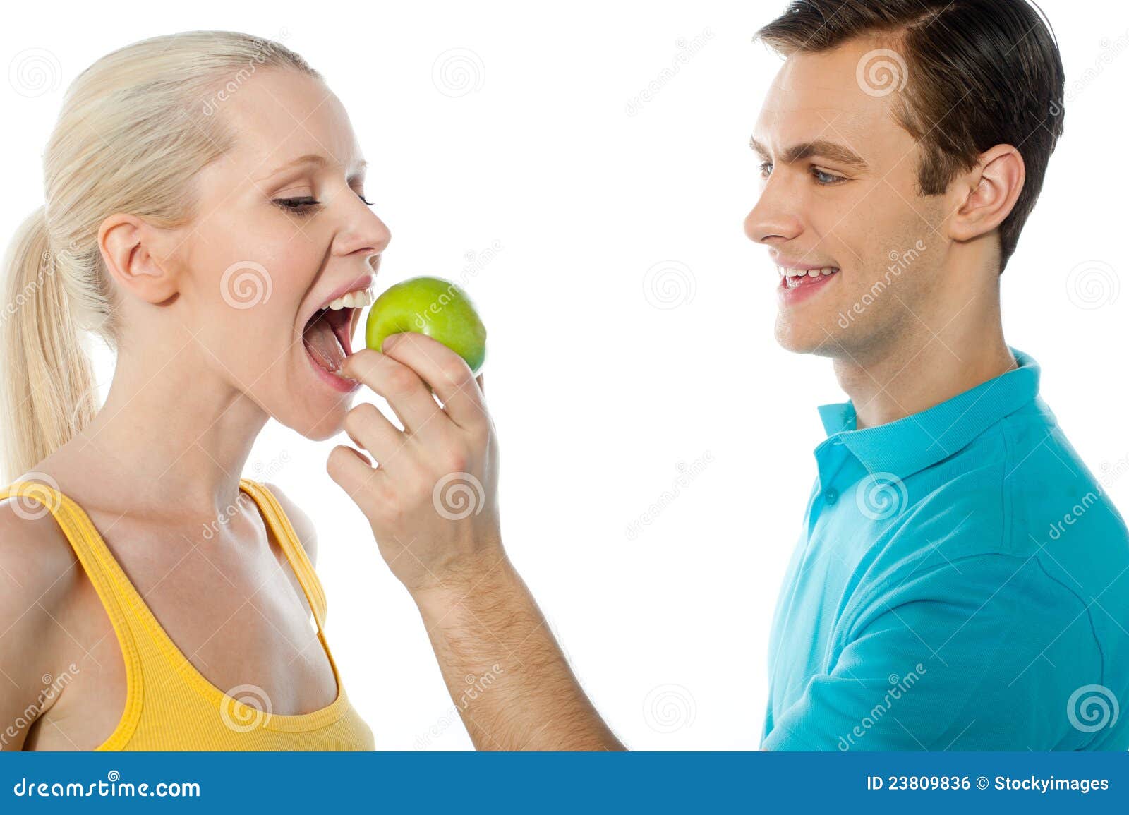 Young Guy Making Her Girlfriend Eat an Apple Stock Photo - Image of ...