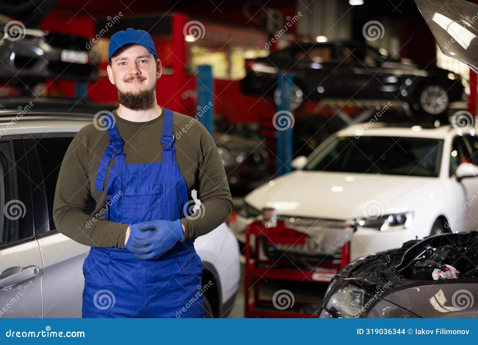 Young Guy Mechanic Posing at Car Service Station Stock Photo - Image of ...