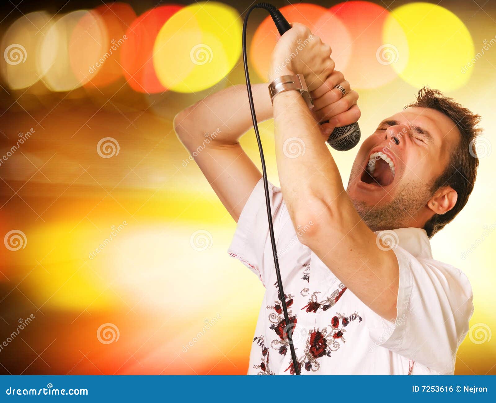 Young Guy with a Microphone Stock Photo - Image of explosion, blurred ...