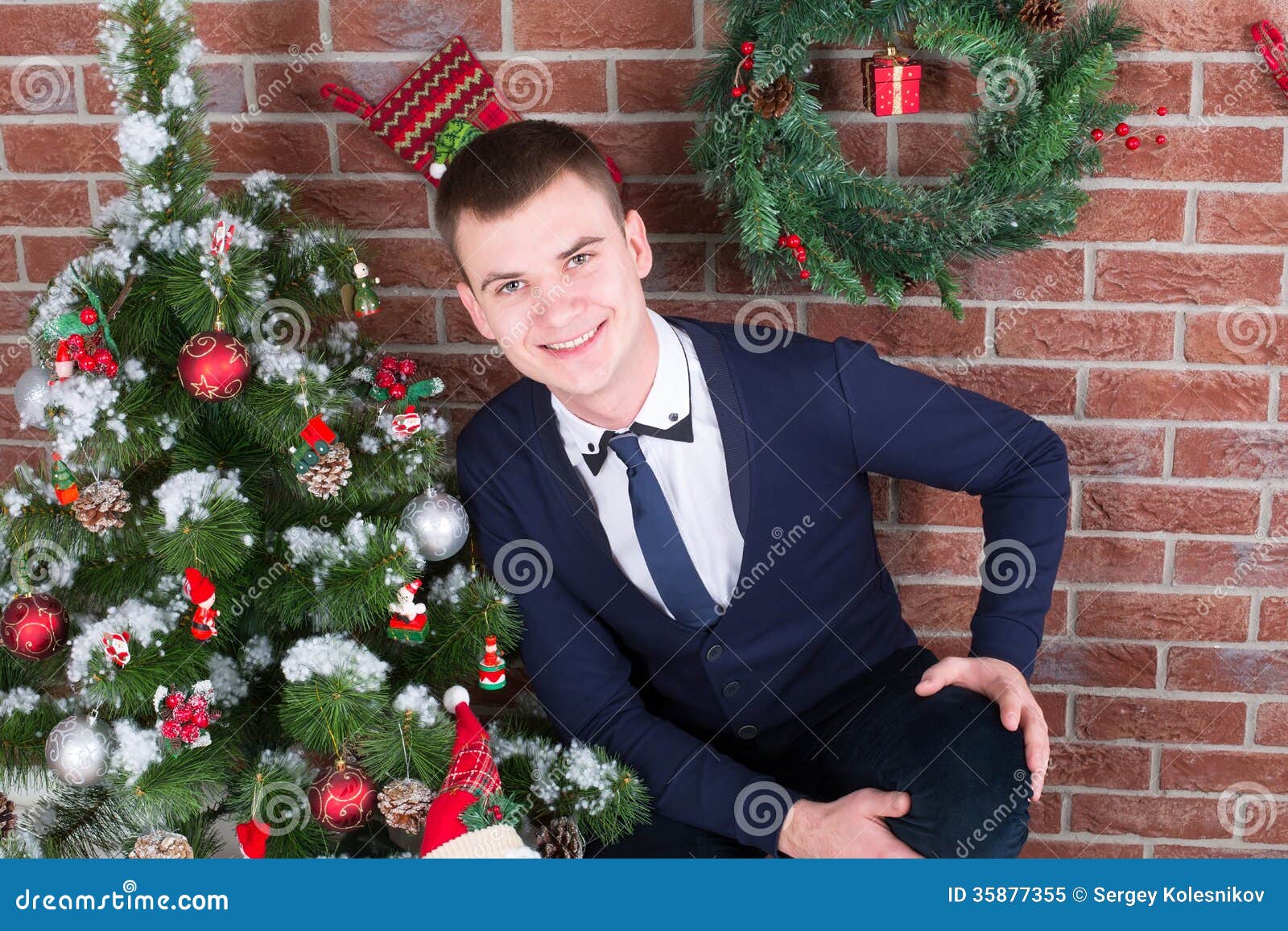 Young Guy Next To a Christmas Tree Stock Image - Image of christmas ...