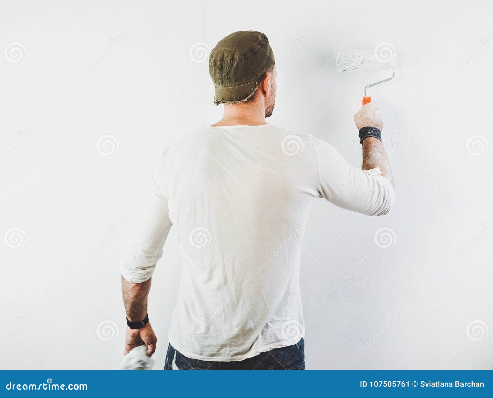 Young Guy Painting a Wall in the House Stock Image - Image of design ...