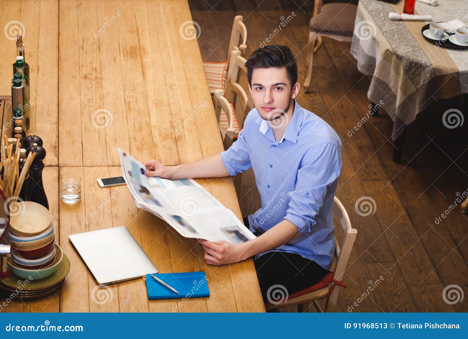 Young Guy Read a Newspaper in the Italian Style Kitchen Stock Image ...