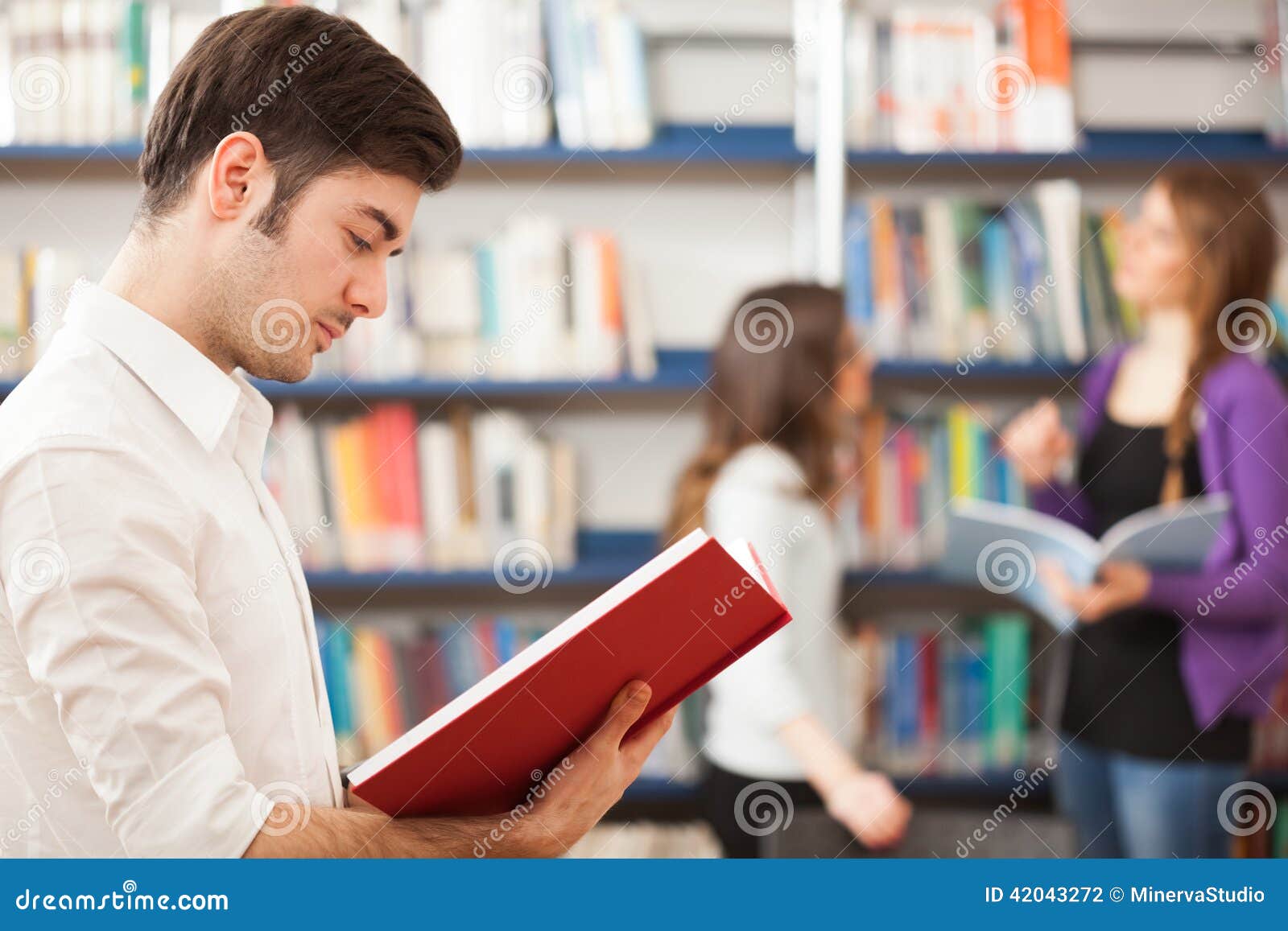 Young guy reading a book stock photo. Image of school - 42043272