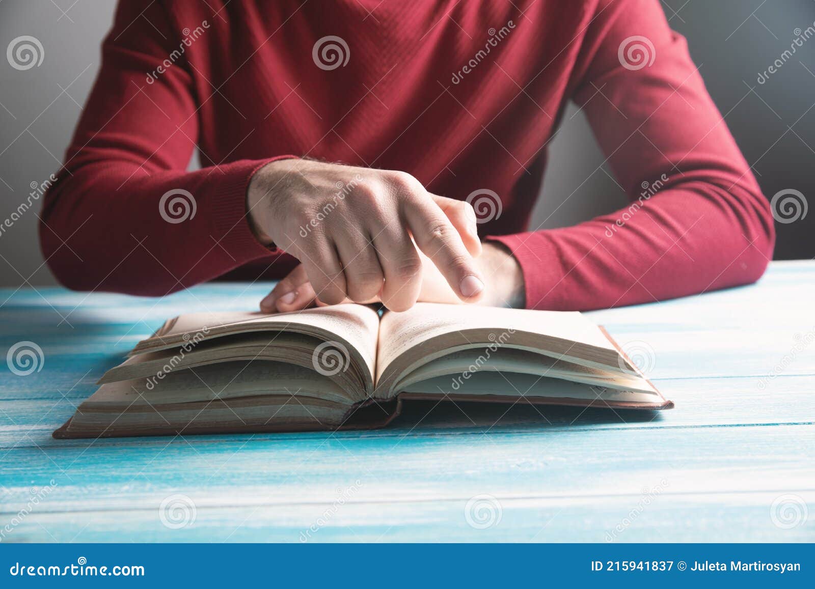 Young guy reading a book stock image. Image of handsome - 215941837