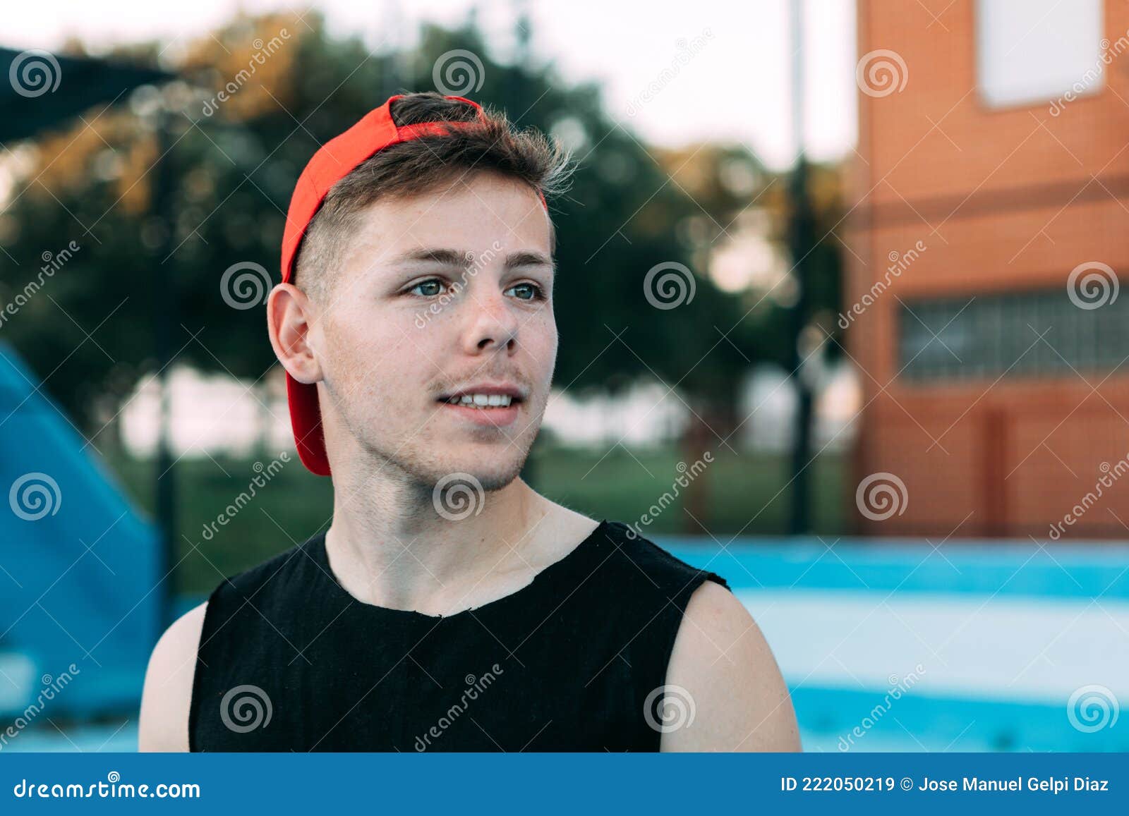 Young guy with red cap stock image. Image of athletic - 222050219