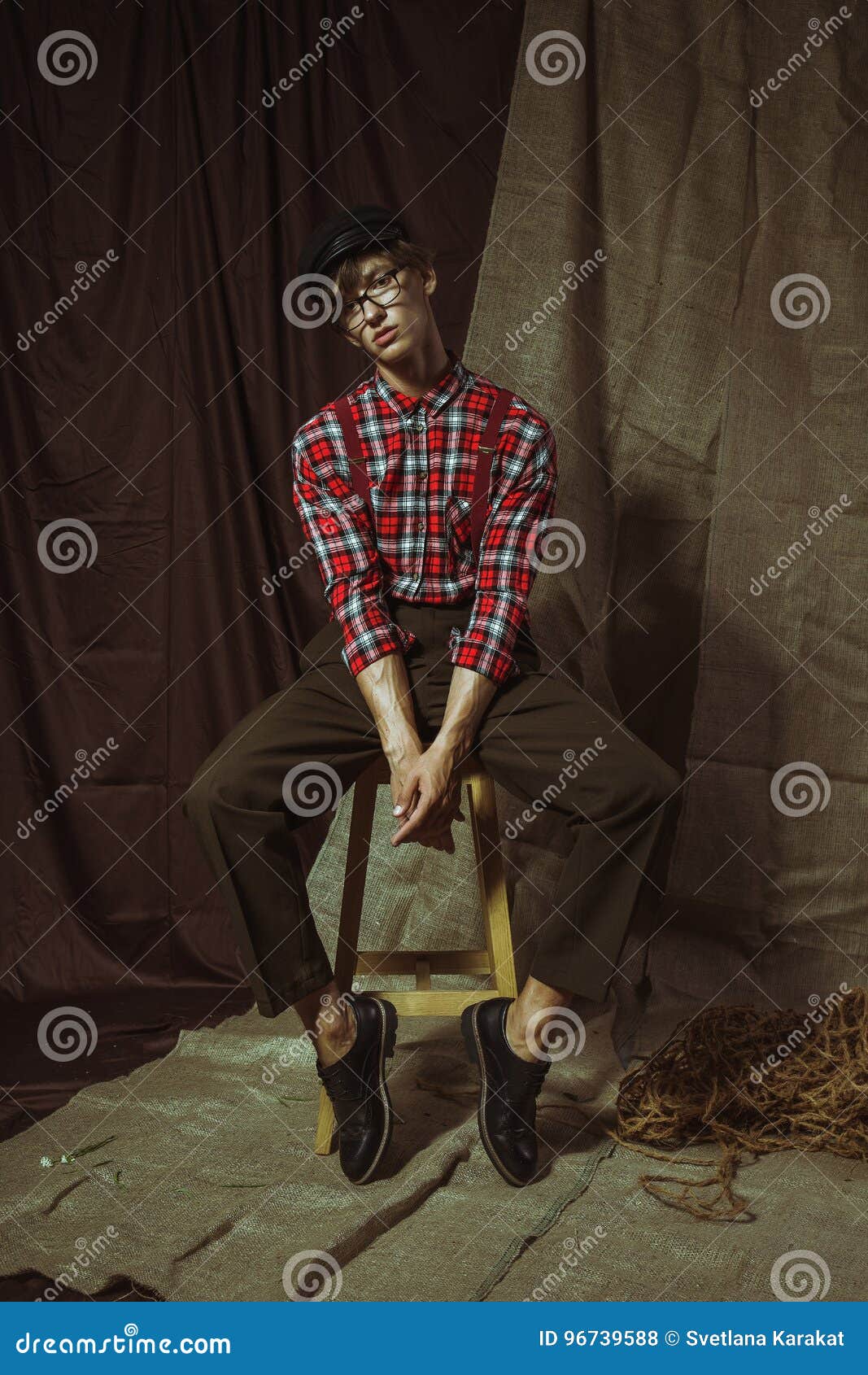 A Young Guy Relaxes Sitting on a Chair Stock Photo - Image of gaze ...