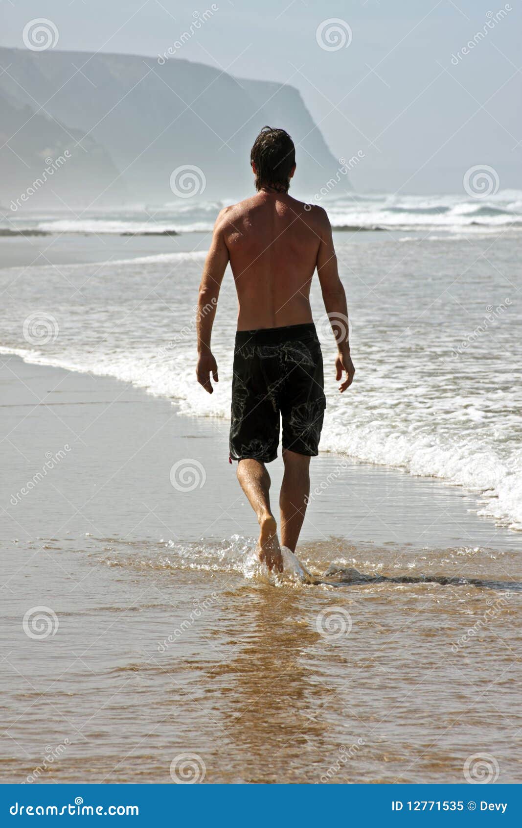Young Guy Relaxing and Walking Along the Beach Stock Image - Image of ...