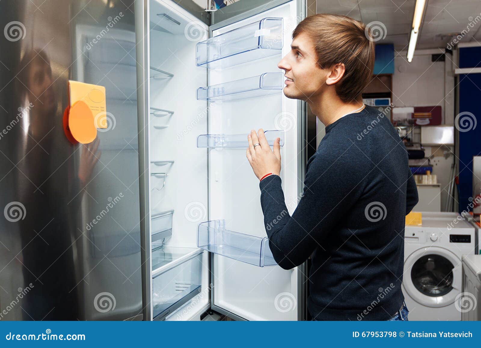Young Guy Selecting Domestic Refrigerator Stock Photo - Image of ...