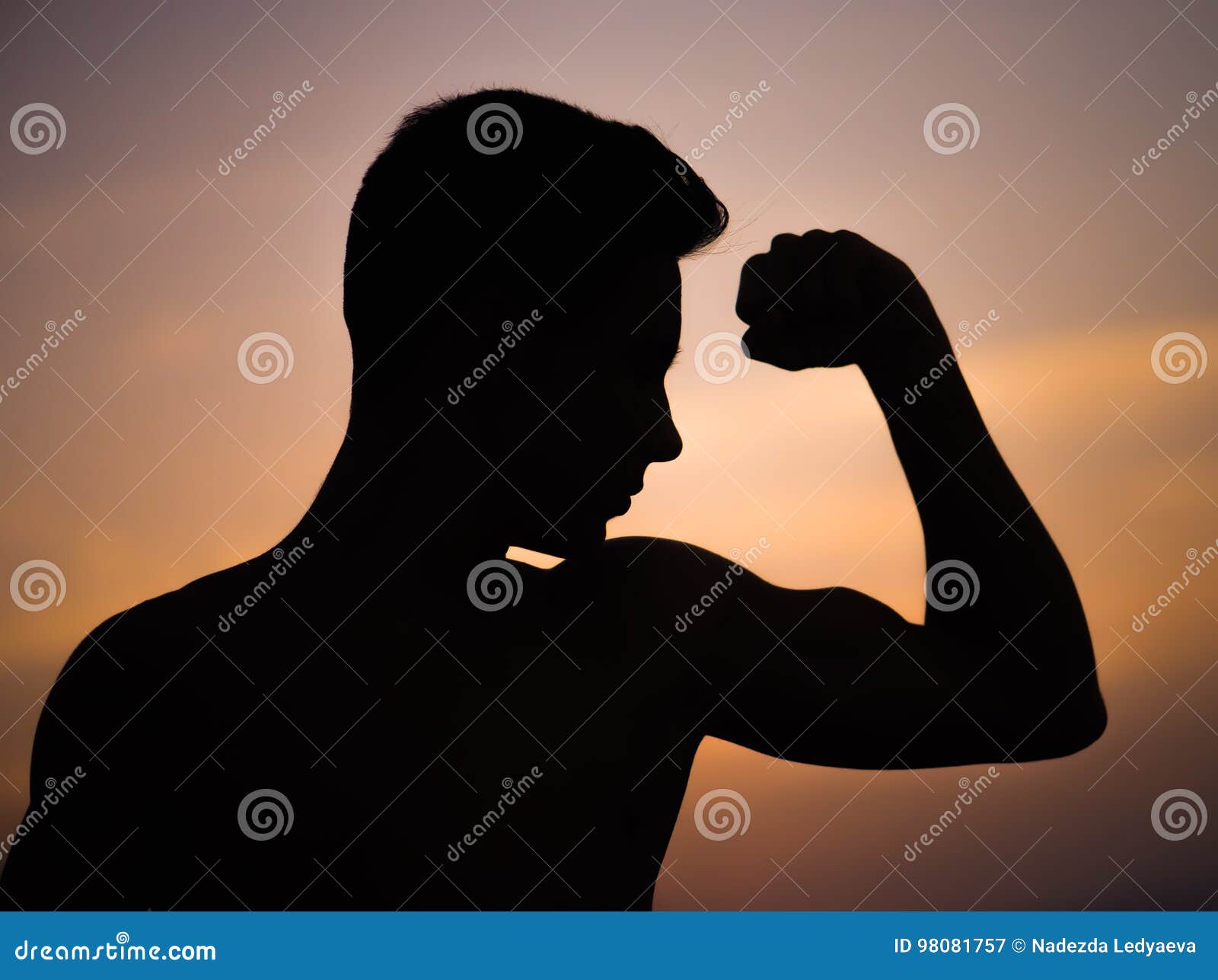 Young guy shows strength stock image. Image of lifestyle - 98081757