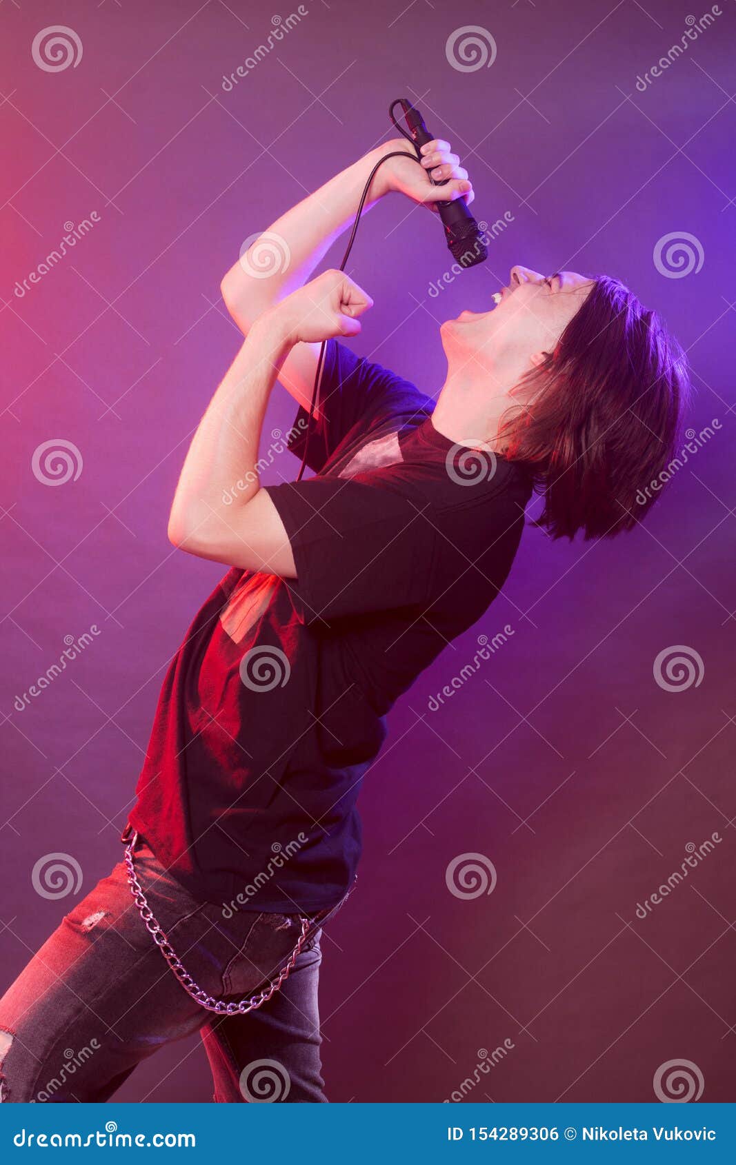 Young guy singing on stage stock photo. Image of expression - 154289306