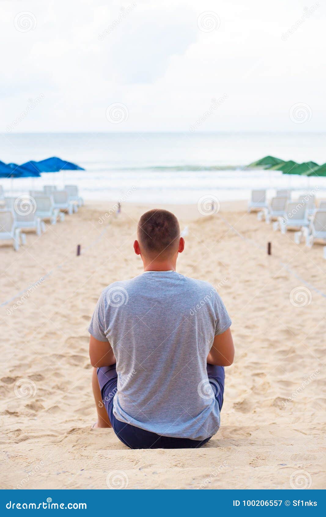 Young Guy Sits with His Back on a Sandy Beach Stock Image - Image of ...