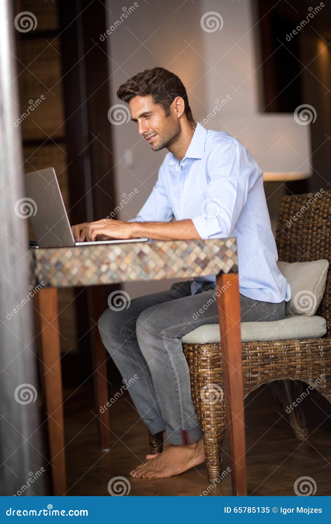 Young Guy Sitting at Home and Using Laptop Computer Stock Image - Image ...