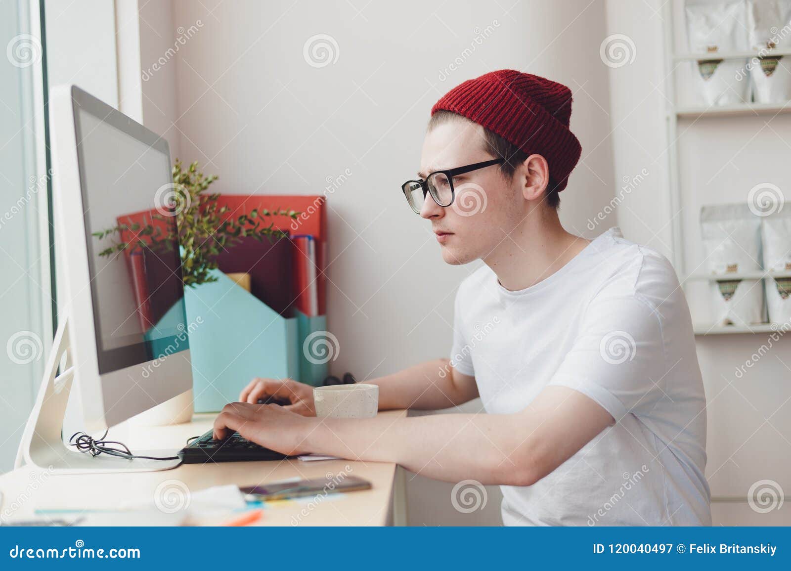 Young Guy Sitting and Working at the Computer Stock Image - Image of ...