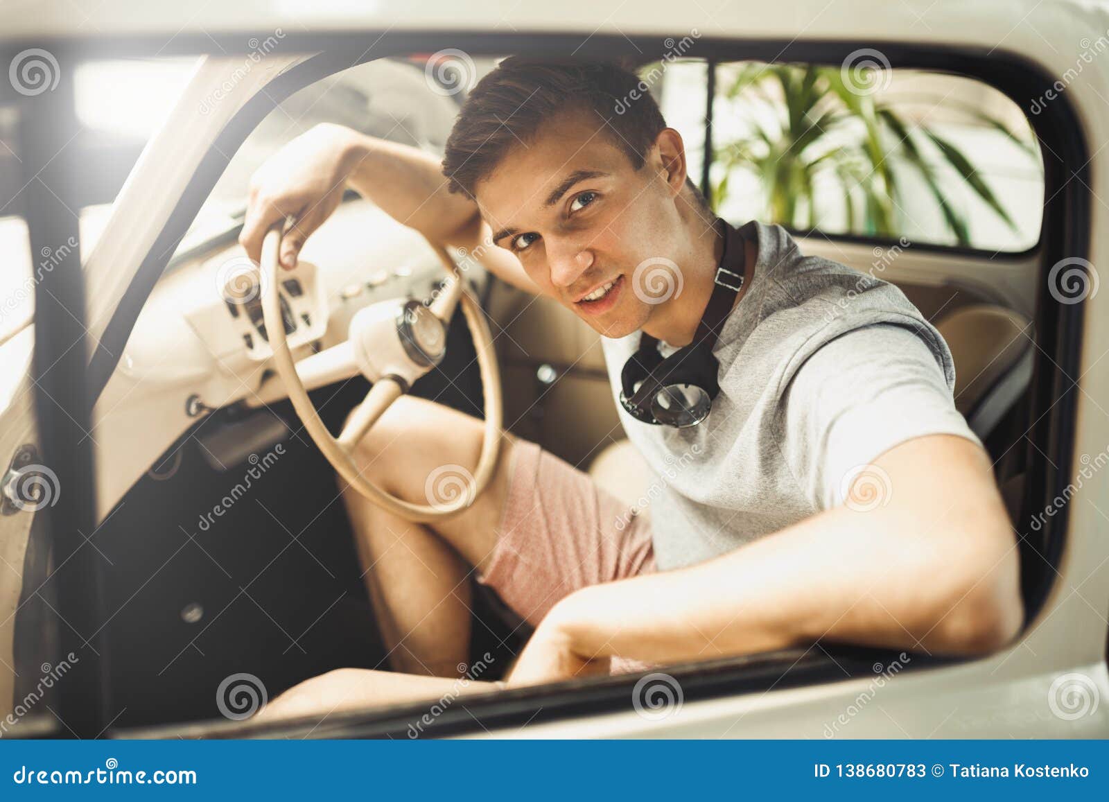 A Young Guy is Sitting in a Vintage Car Stock Image - Image of road ...