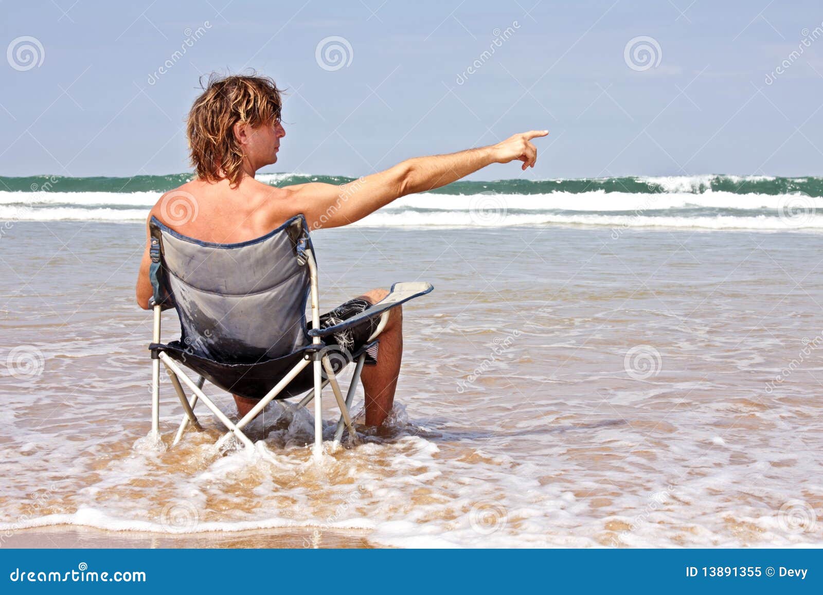 Young Guy Sitting in the Water from the Ocean Stock Image - Image of ...
