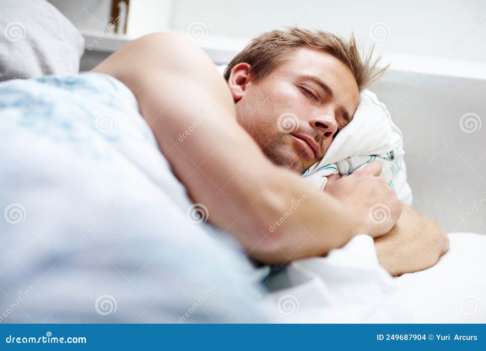 He Needs Plenty of Sleep. Young Guy Sleeping Deeping in Bed at Home ...