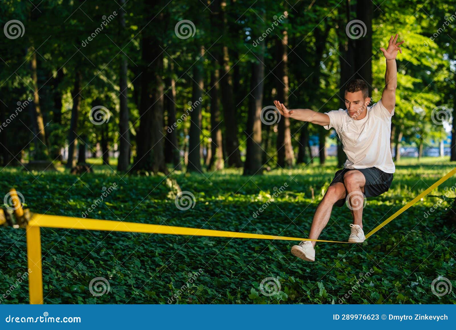 Young Guy in Sportwear Walking on the Rope and Looking Focused Stock ...