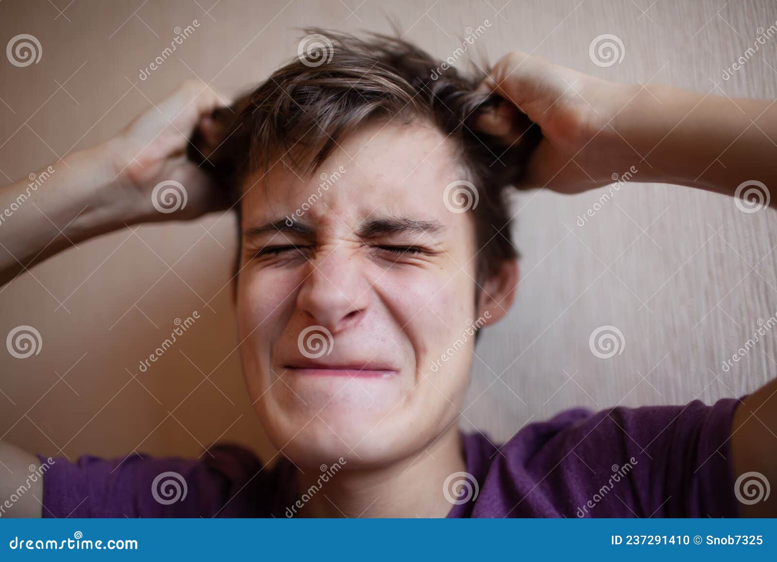 Young Guy Squeezes His Head with His Hands Stock Photo - Image of ...