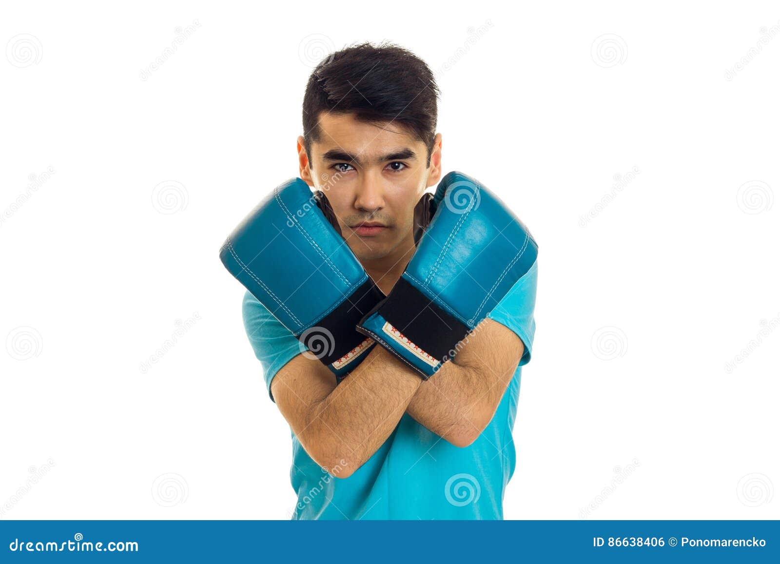Young Guy Stands Folded Arms in Blue Boxing Gloves is Isolated on a ...