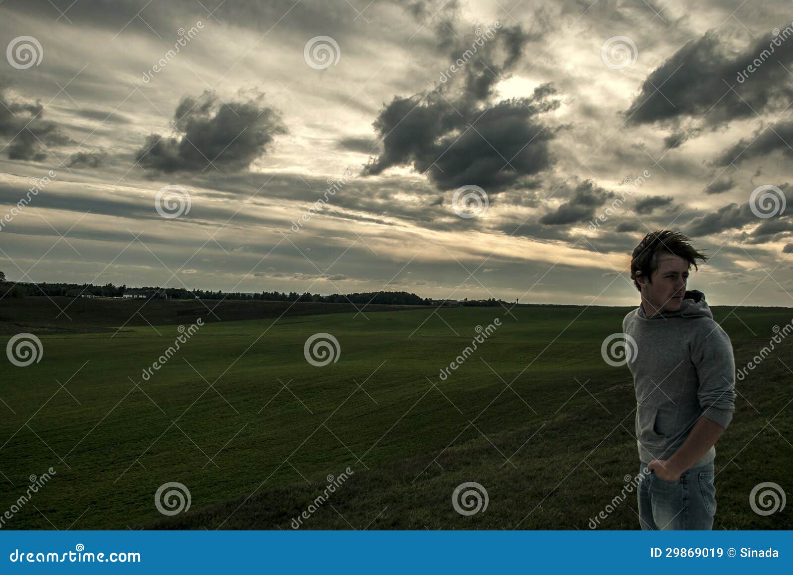 Young Guy Stay in the Field with Wind Stock Image - Image of weather ...