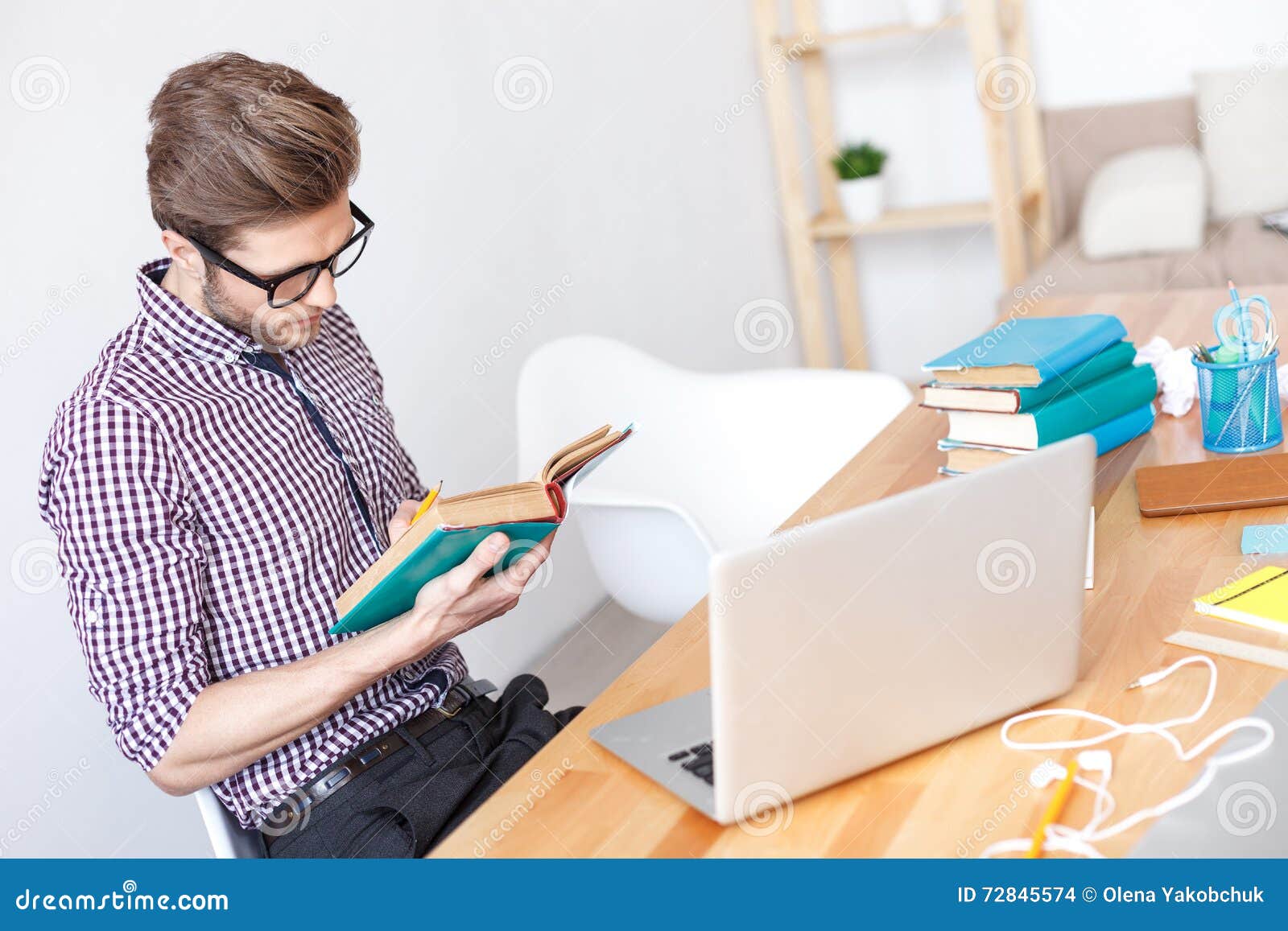 Young guy studying at home stock photo. Image of studying - 72845574