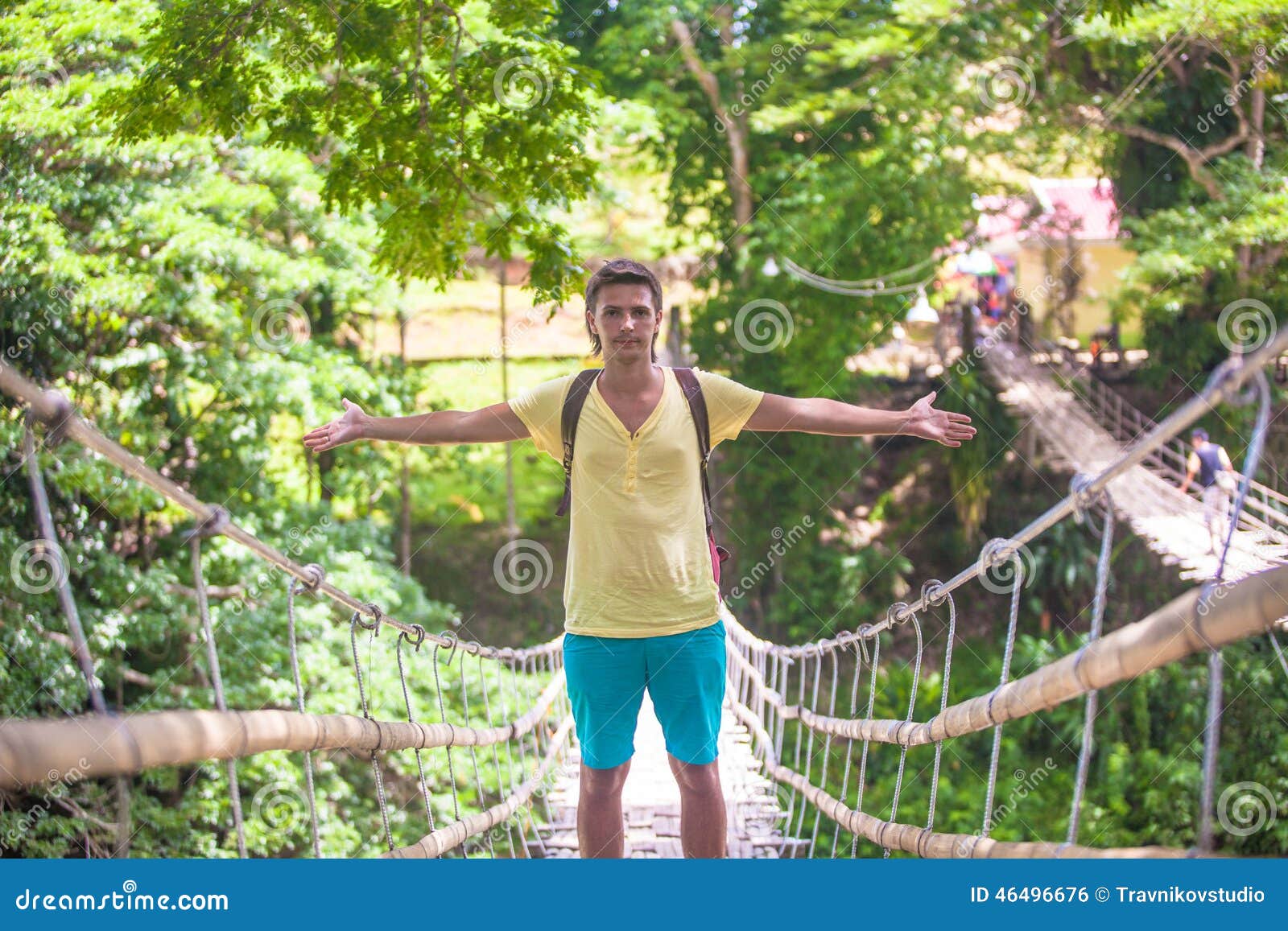 Young Guy on Suspension Bridge Over the River Stock Photo - Image of ...