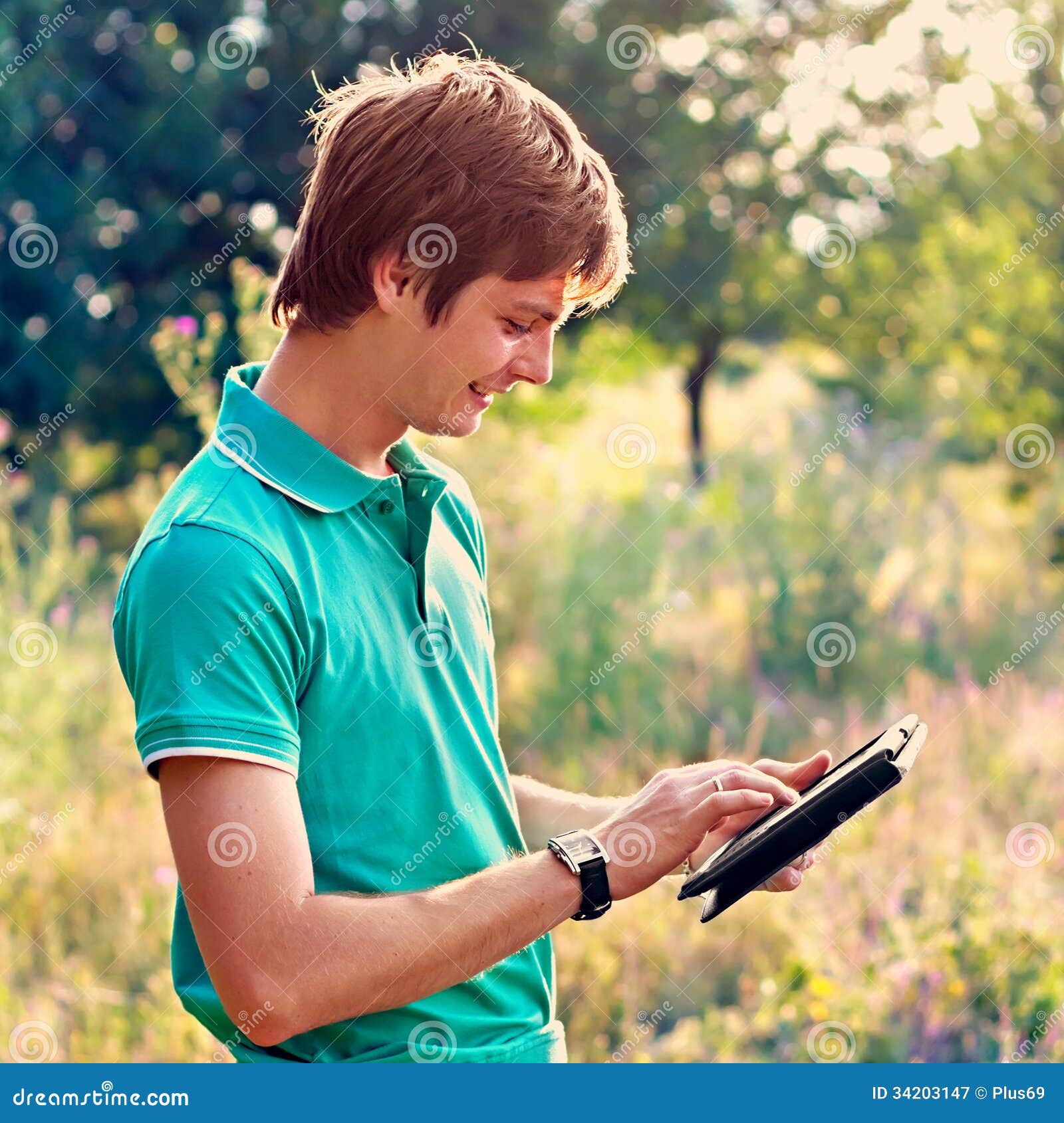 Young Guy with a Tablet Outdoors Stock Image - Image of learning, blue ...