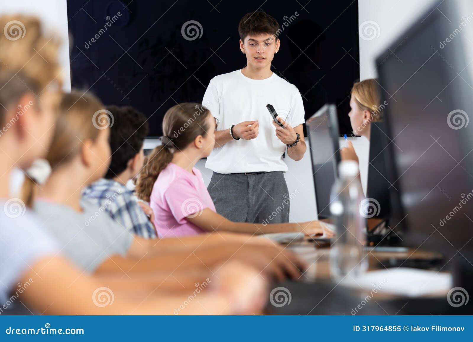 Guy Teacher Teaches Group of Students in Computer Class Stock Image ... Guy Teacher Teaches Group of Students in Computer Class Stock Image ...