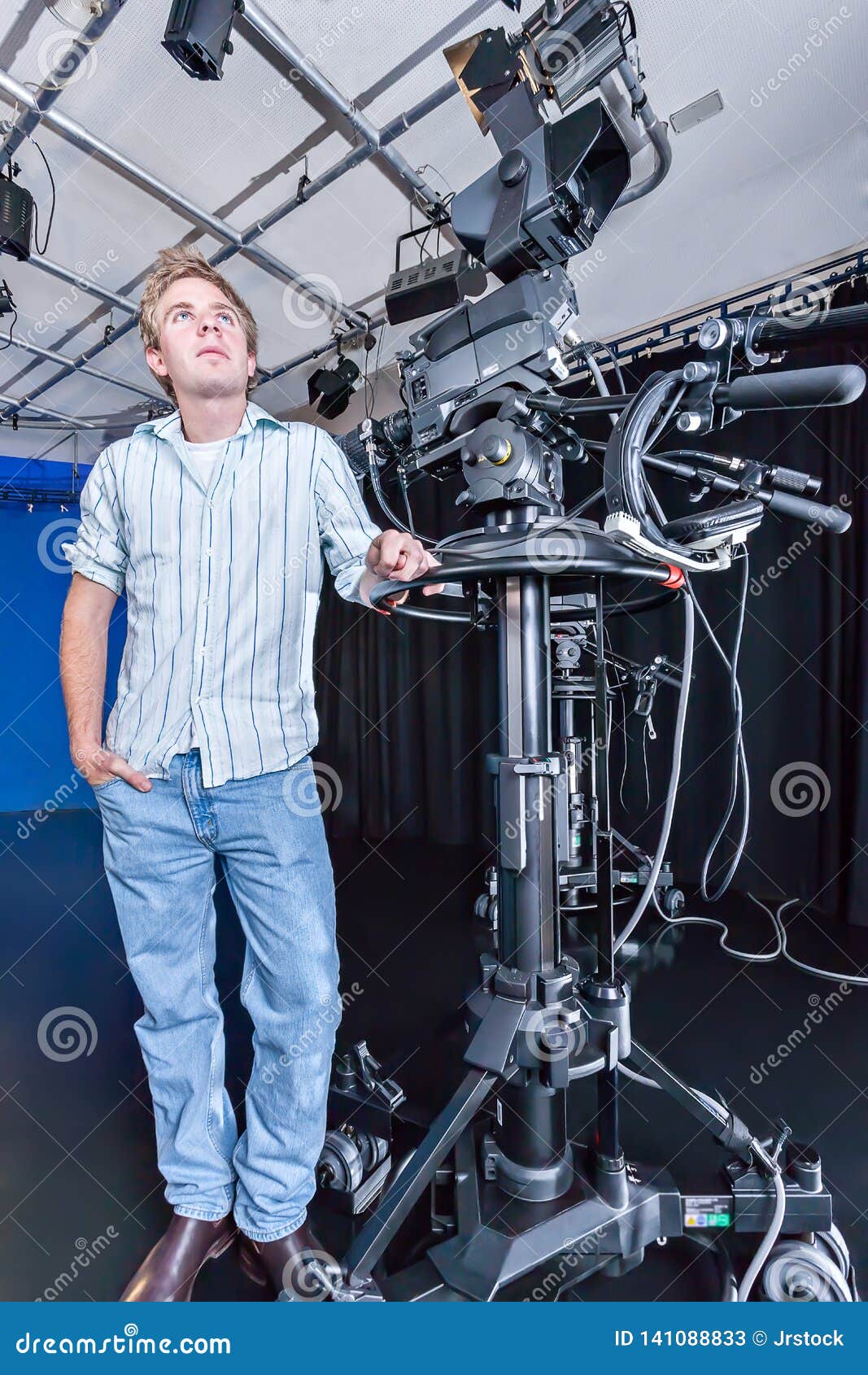 Young Guy Touching a Camera and Look Up Stock Image - Image of digital ...
