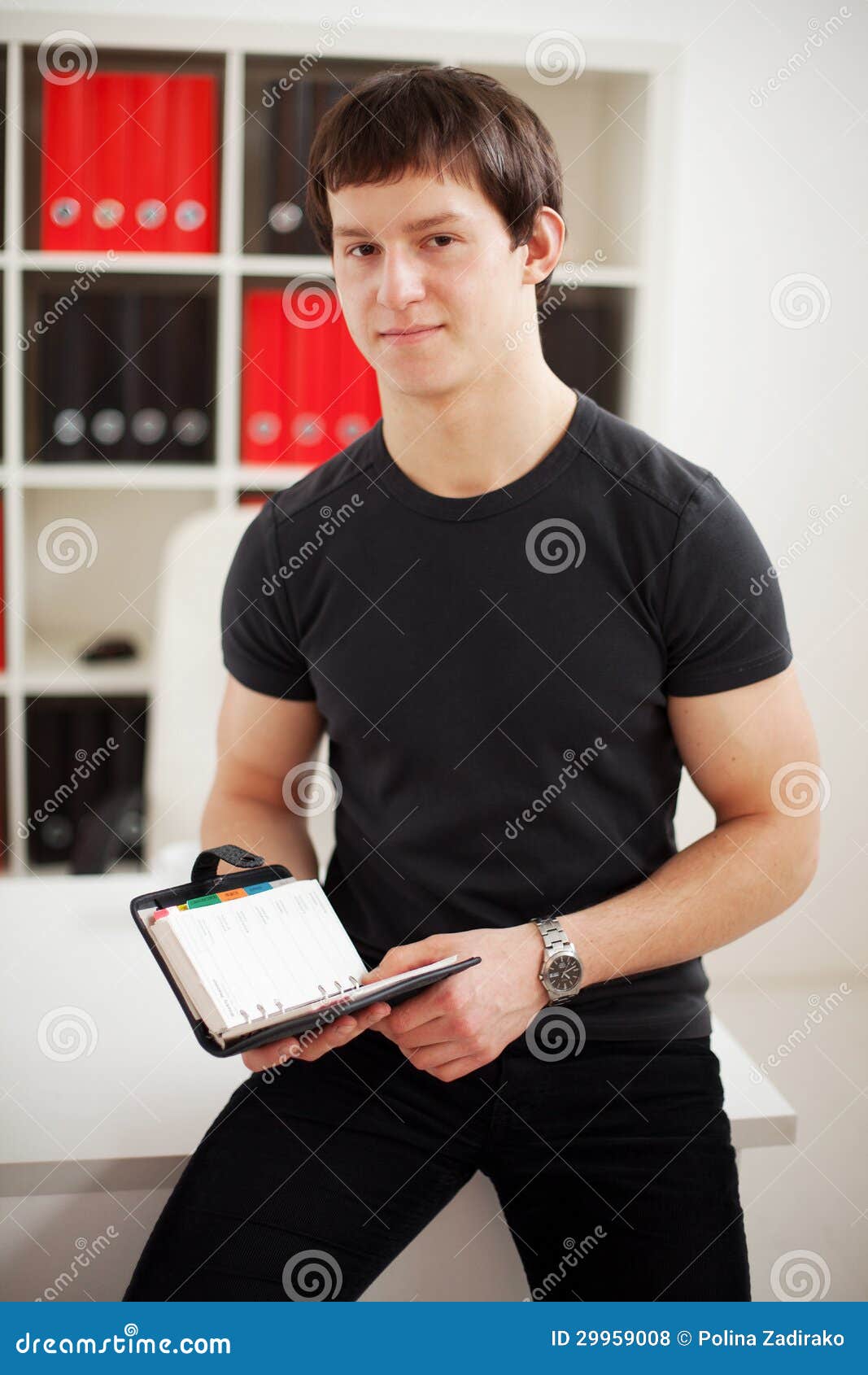 Young guy using diary stock photo. Image of confident - 29959008