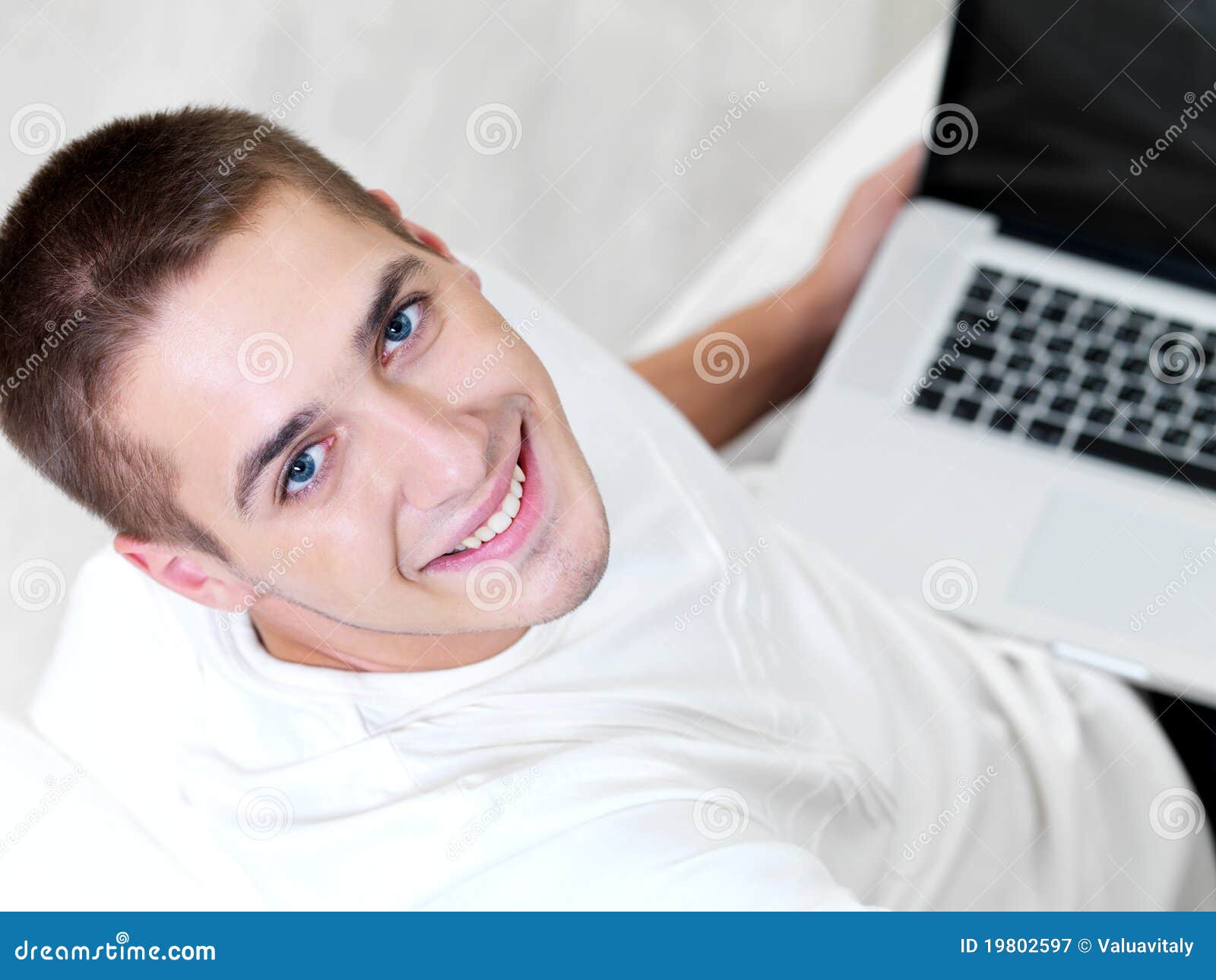Young guy using laptop stock image. Image of indoors - 19802597